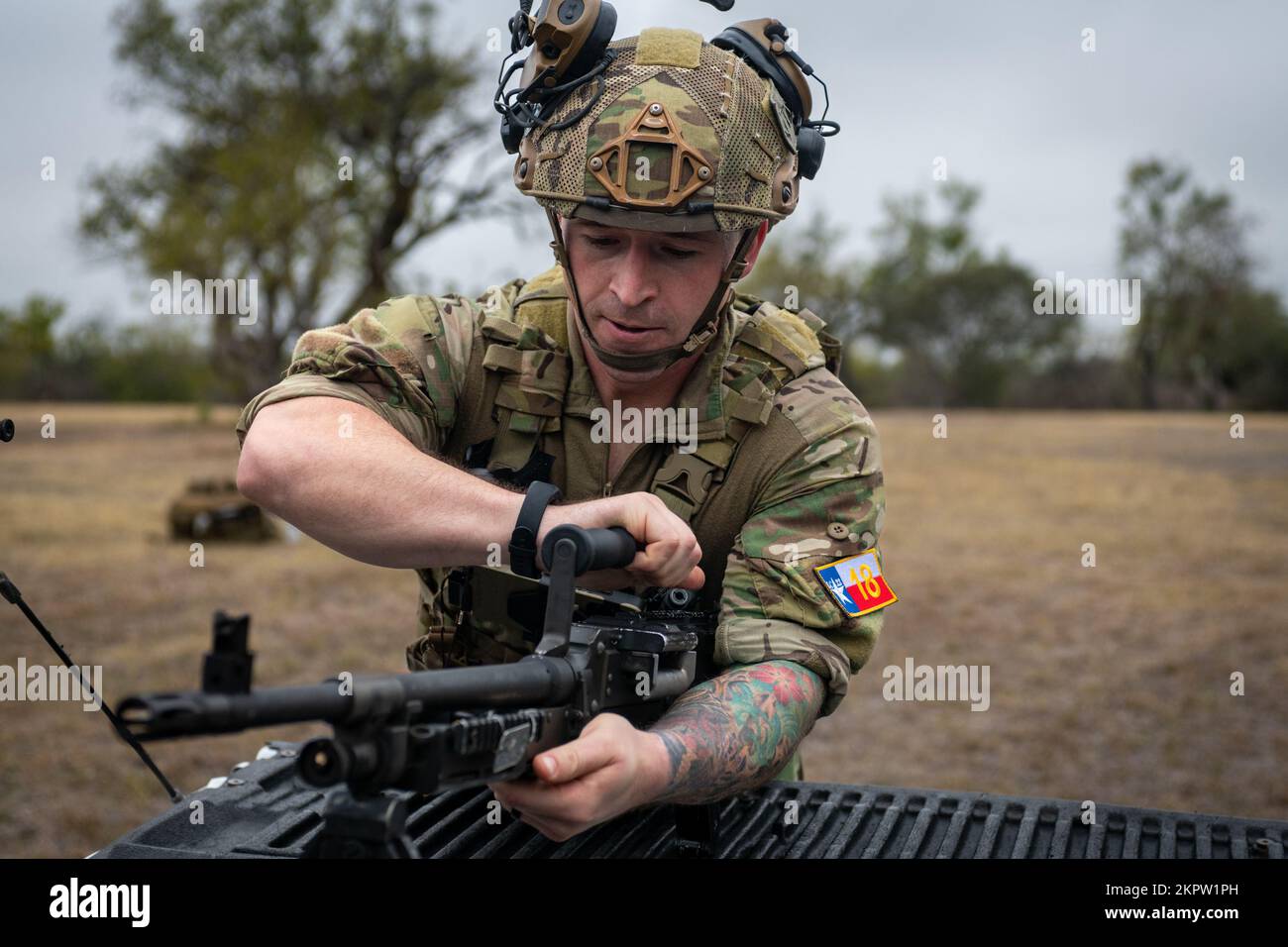 A Tactical Air Control Party Airman disassembles and assembles a M-240 ...