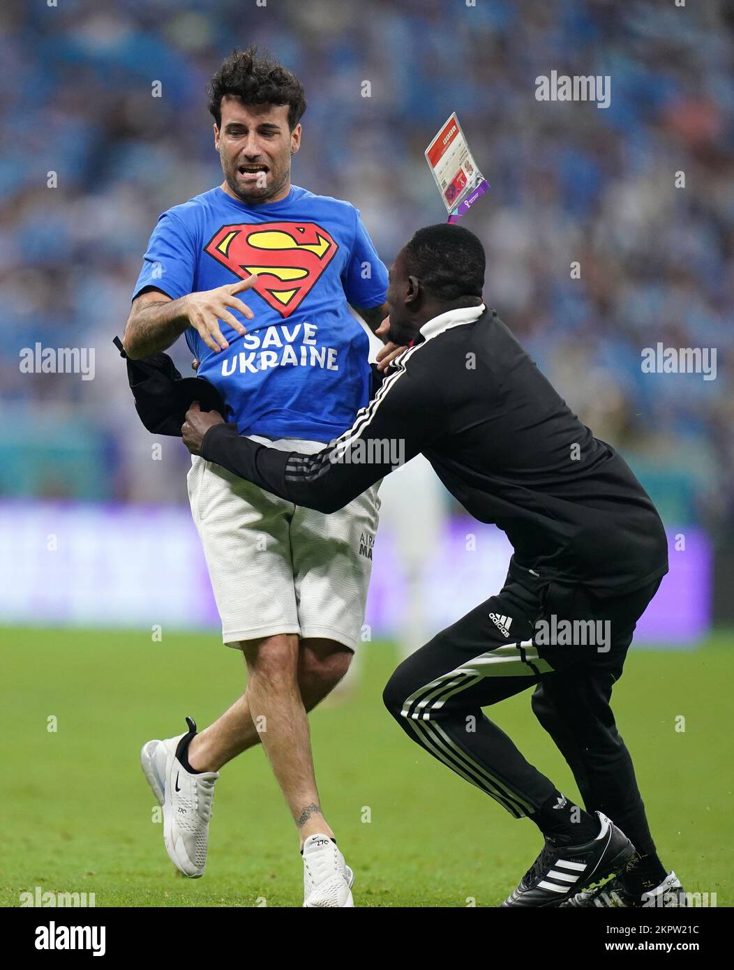 A pitch invader with a 'Save Ukraine' t-shirt on the pitch during the ...