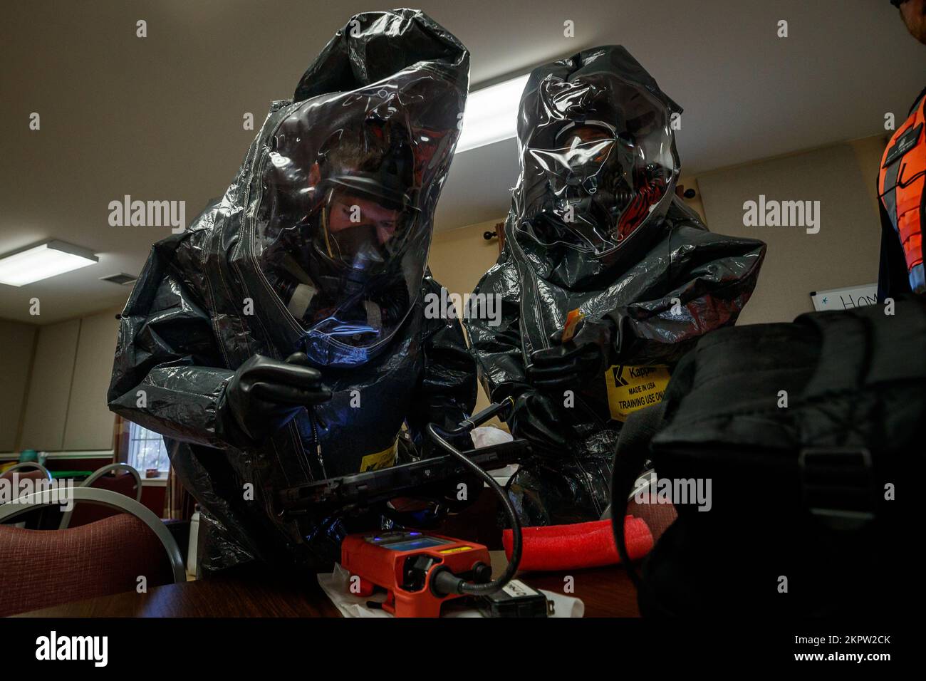U.S. Air Force Staff Sgt. Alex Potts, left, survey team member, and ...