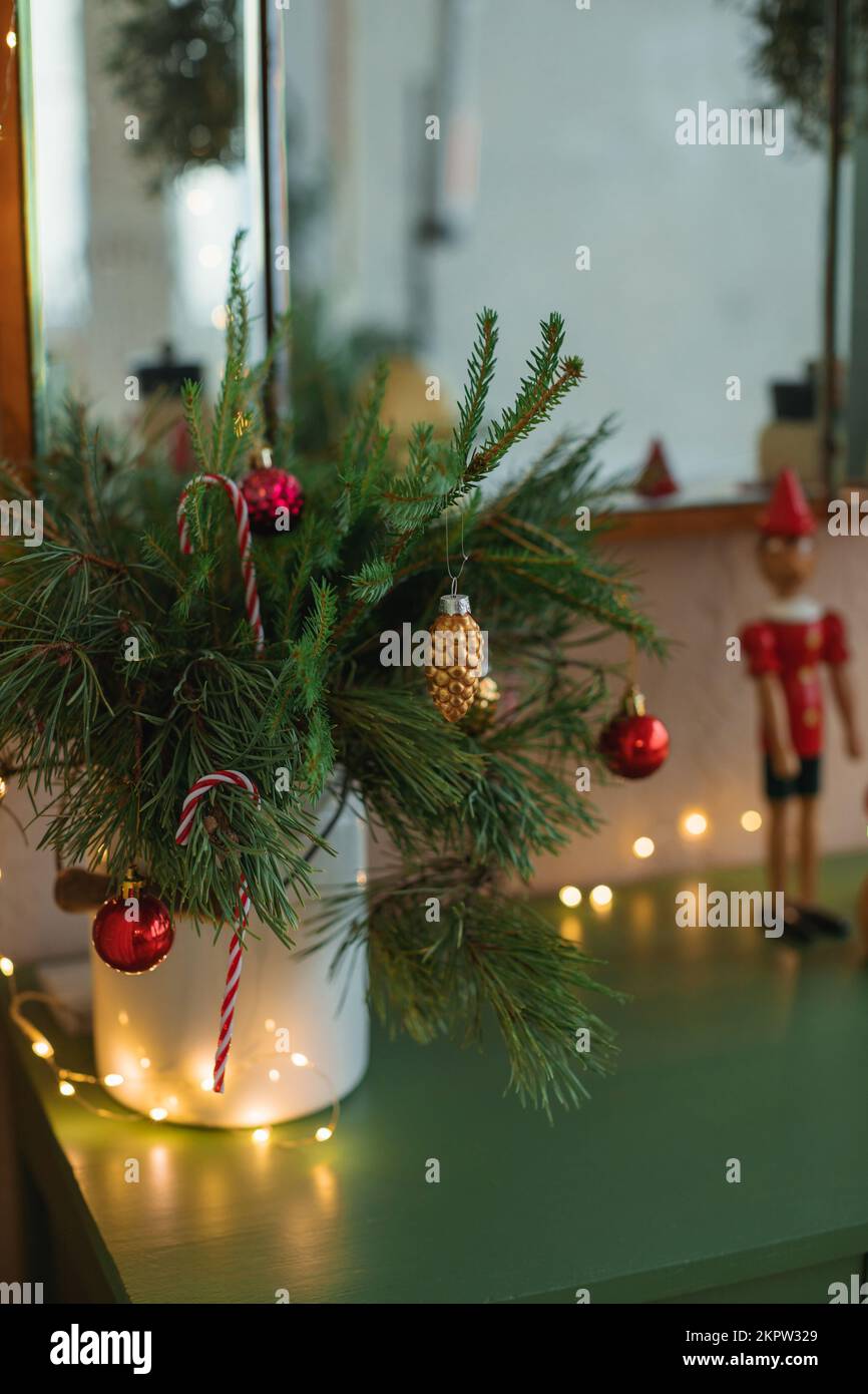 Mirror over a sideboard in a living room decorated with string lights ...