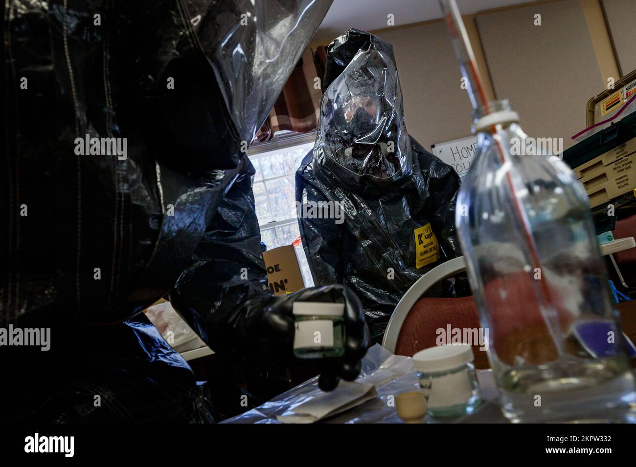 U.S. Air Force Staff Sgt. Alex Potts, right, survey team member, and ...
