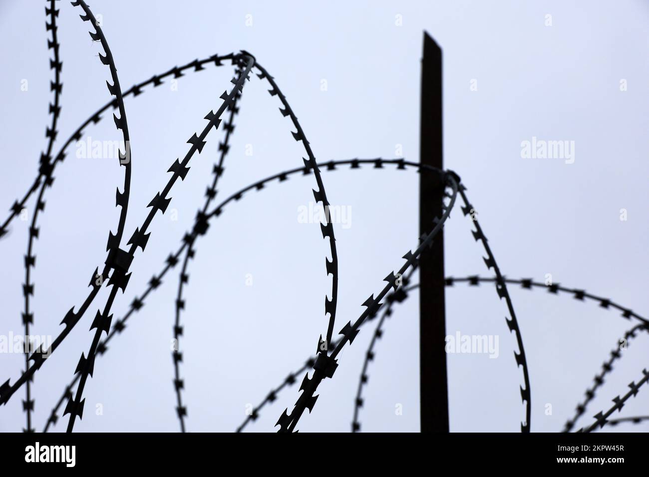 Barbed wire on sky background. Concept of boundary, prison, war or ...
