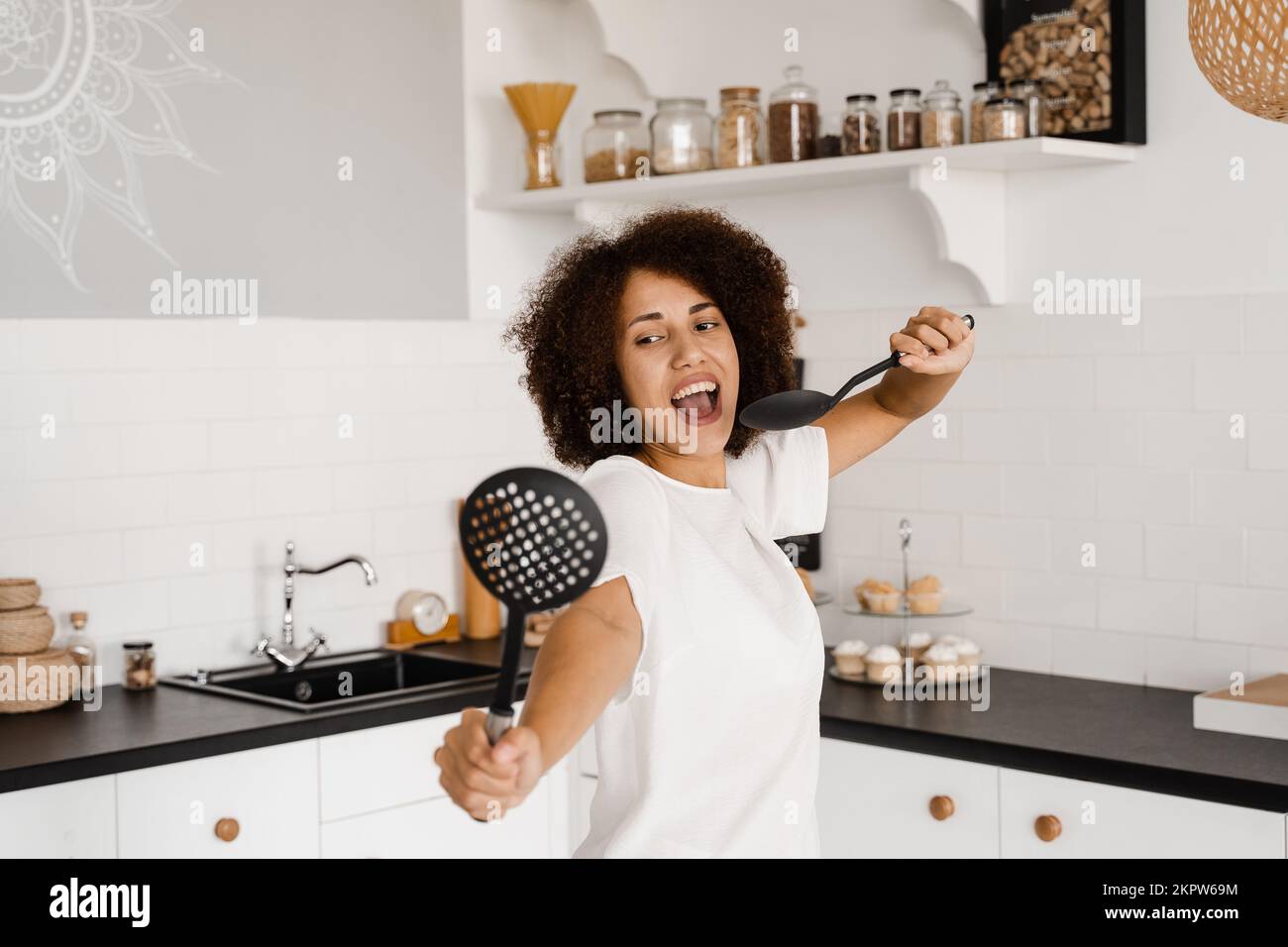 African american girl cook having fun on the kitchen. Advertising for ...