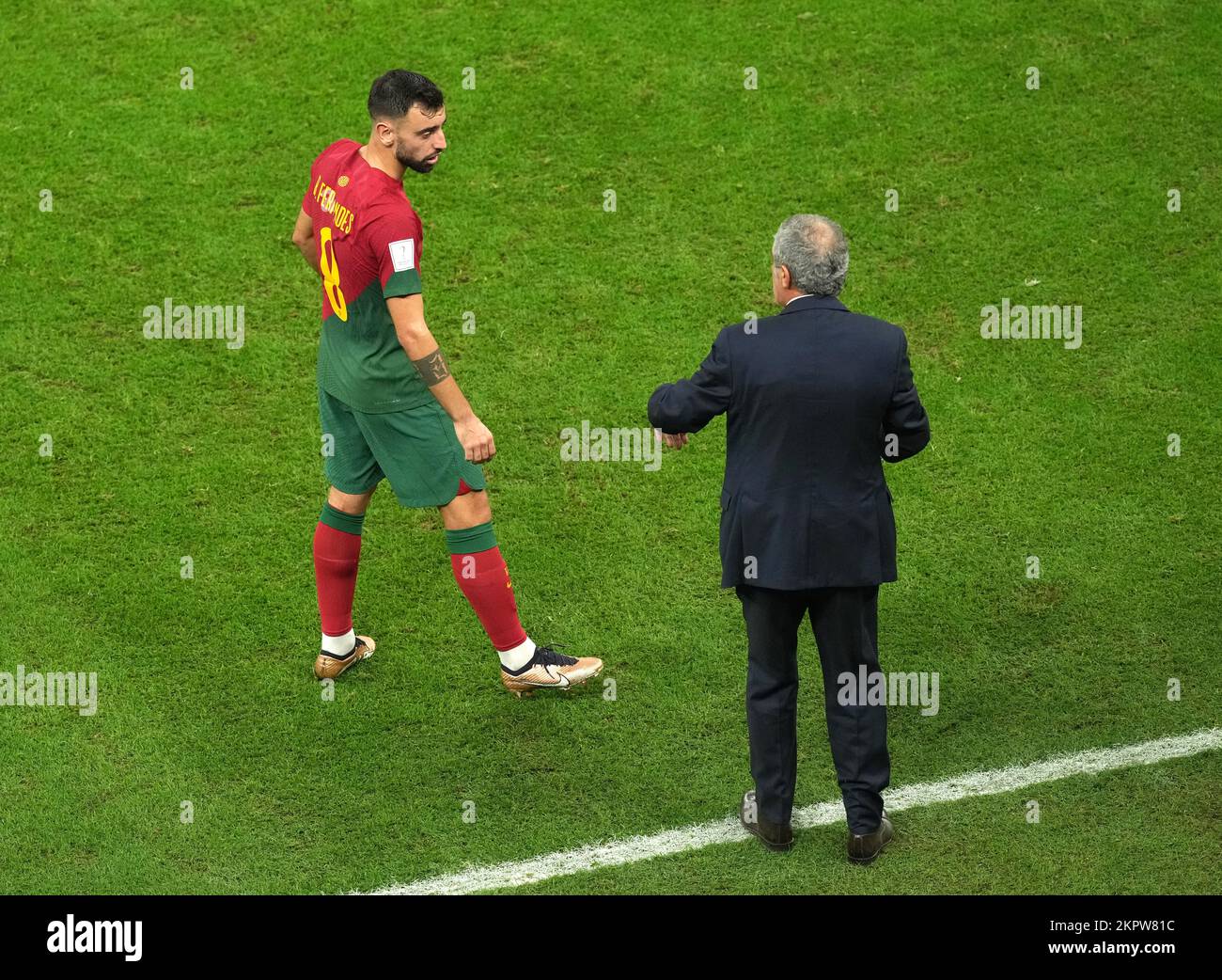 Portugal's Bruno Fernandes speaks to Portugal manager Fernando Santos ...
