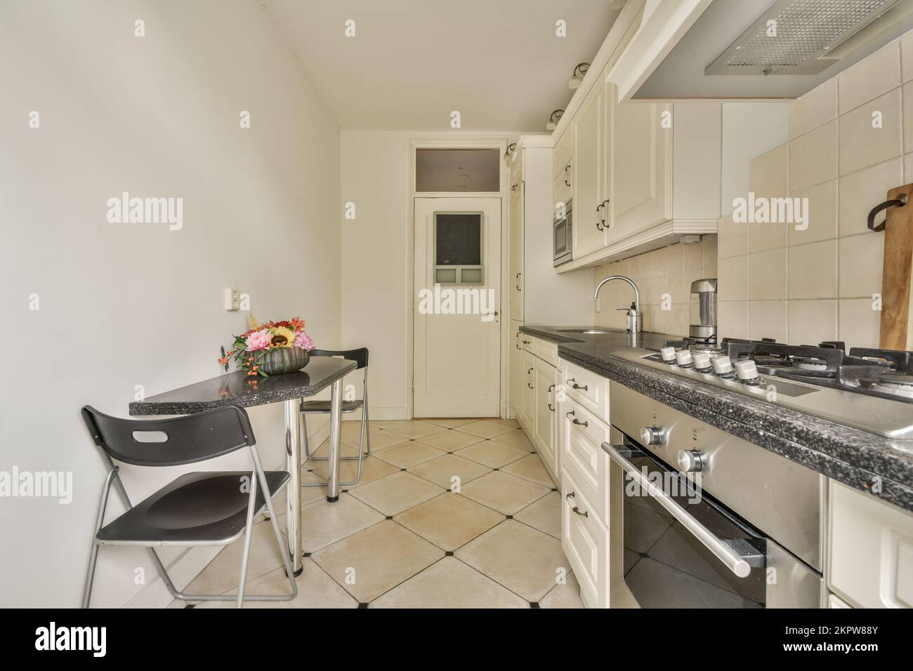 Interior of contemporary kitchen with stylish black cupboards and ...