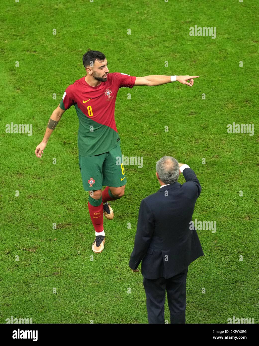 Portugal's Bruno Fernandes speaks to Portugal manager Fernando Santos ...