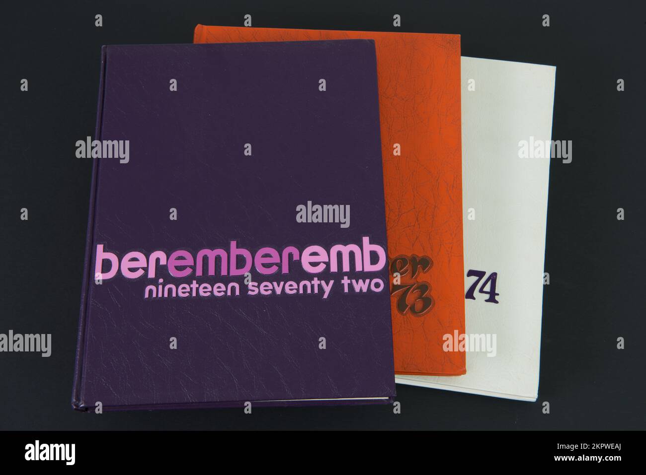 Three colorful high school yearbooks from the years 1972, 1973 and 1974 ...