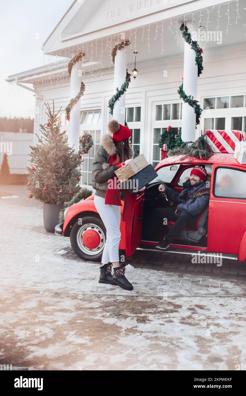 Belarus Minsk 16 12 2019: Happy young family posing near retro car ...