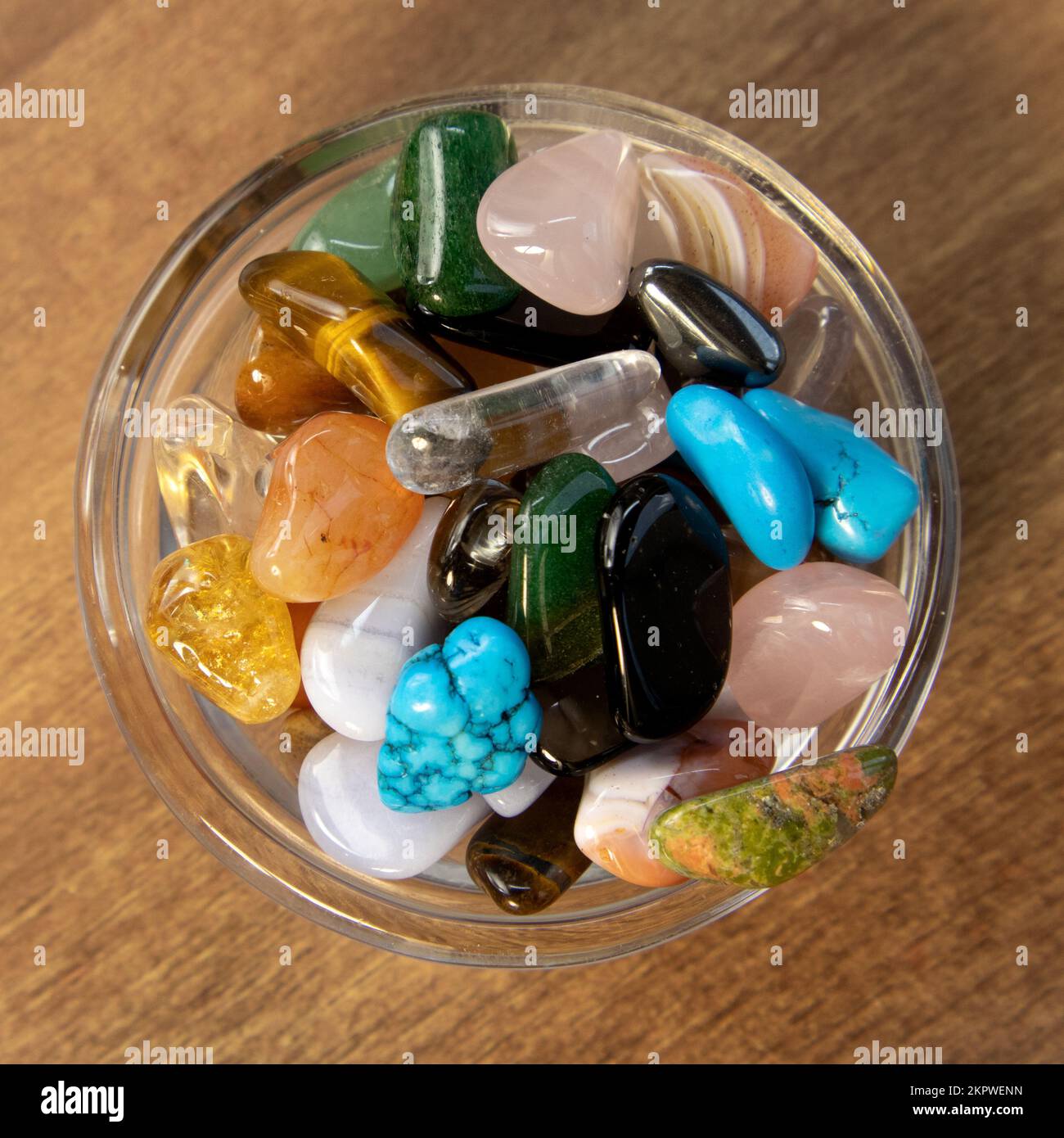 Collection Of Semi-Precious Gemstones on white textured board ...