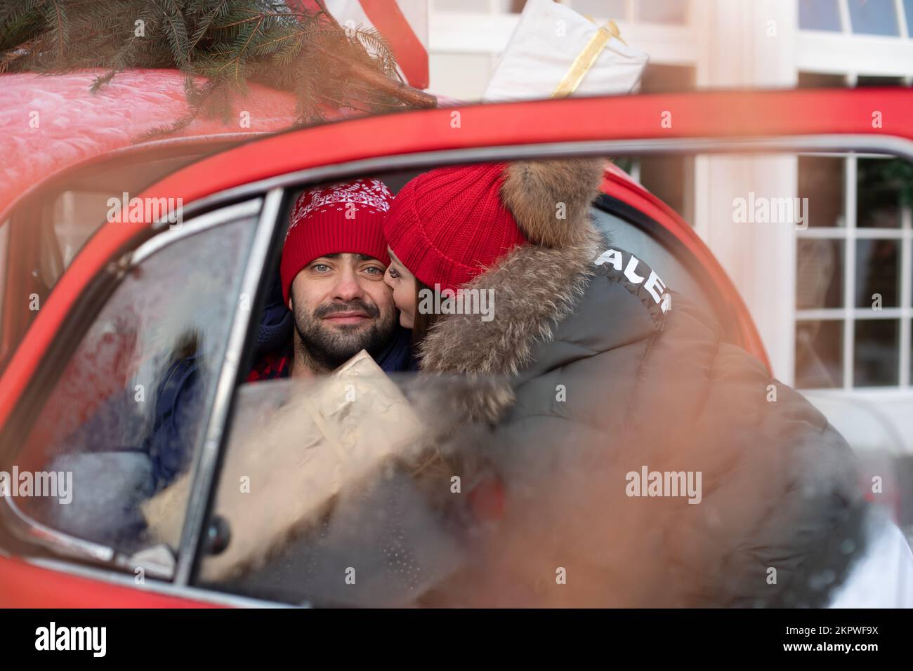 Belarus Minsk 16 12 2019: Happy young family posing near retro car ...