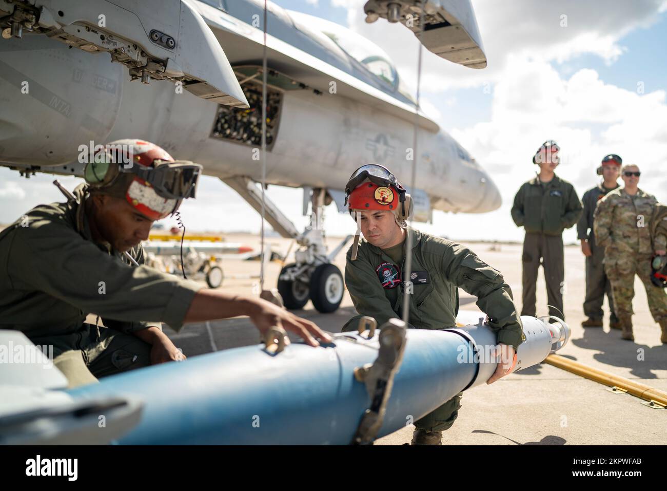 U.S. Marines with the All Type Model Series Armament Team (ATAT) re-arm ...