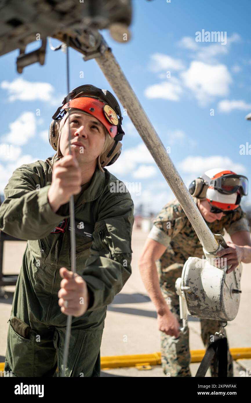 U.S. Marine Corps Staff Sgt. David Emerton (left), a quality assurance ...