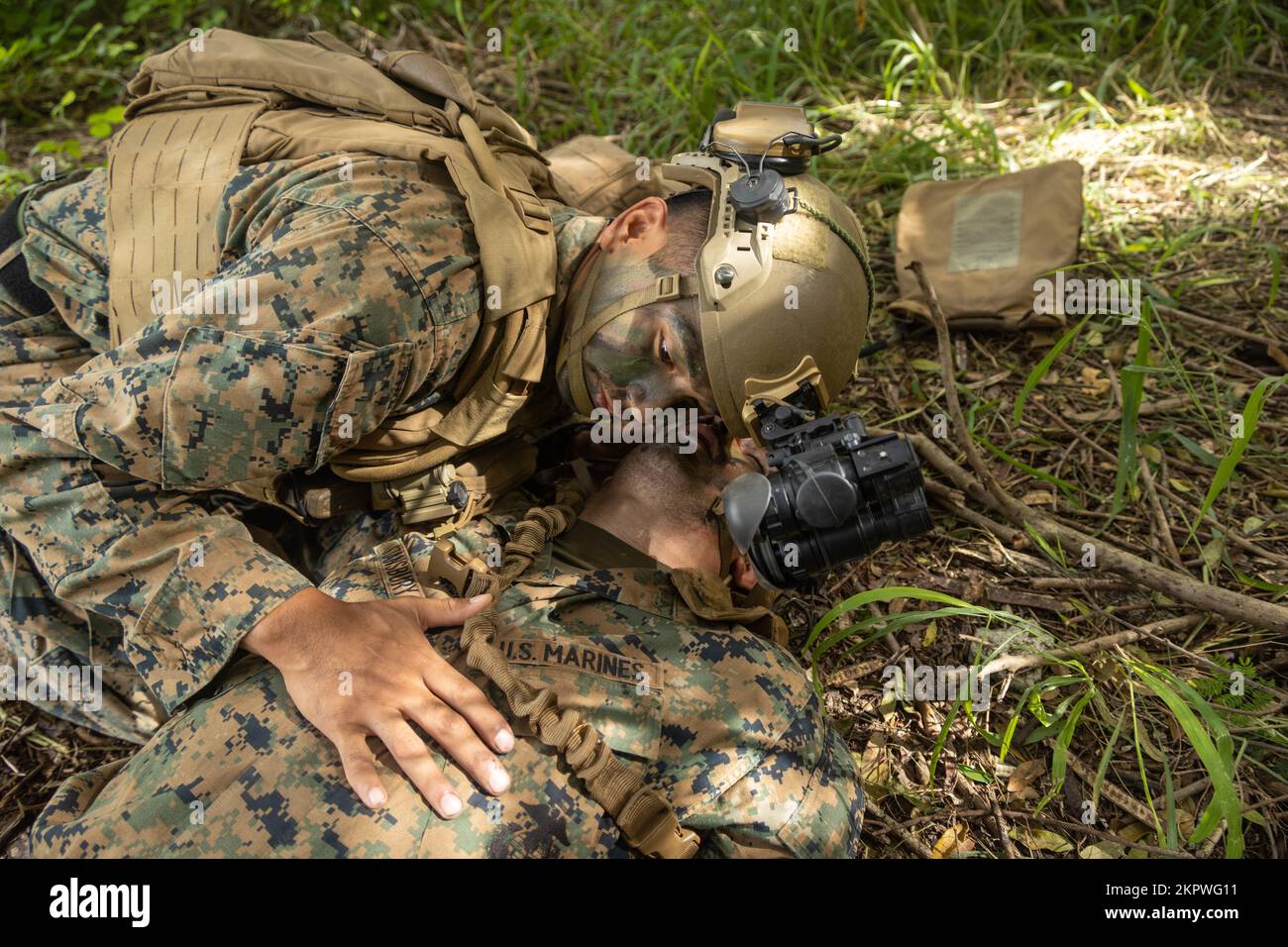 U.S. Navy Petty Officer 3rd Class Damienandr, hospital corpsman, left ...