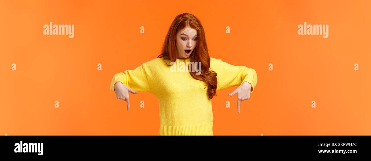 Fascinated and excited redhread hipster girl stare speechless with ...