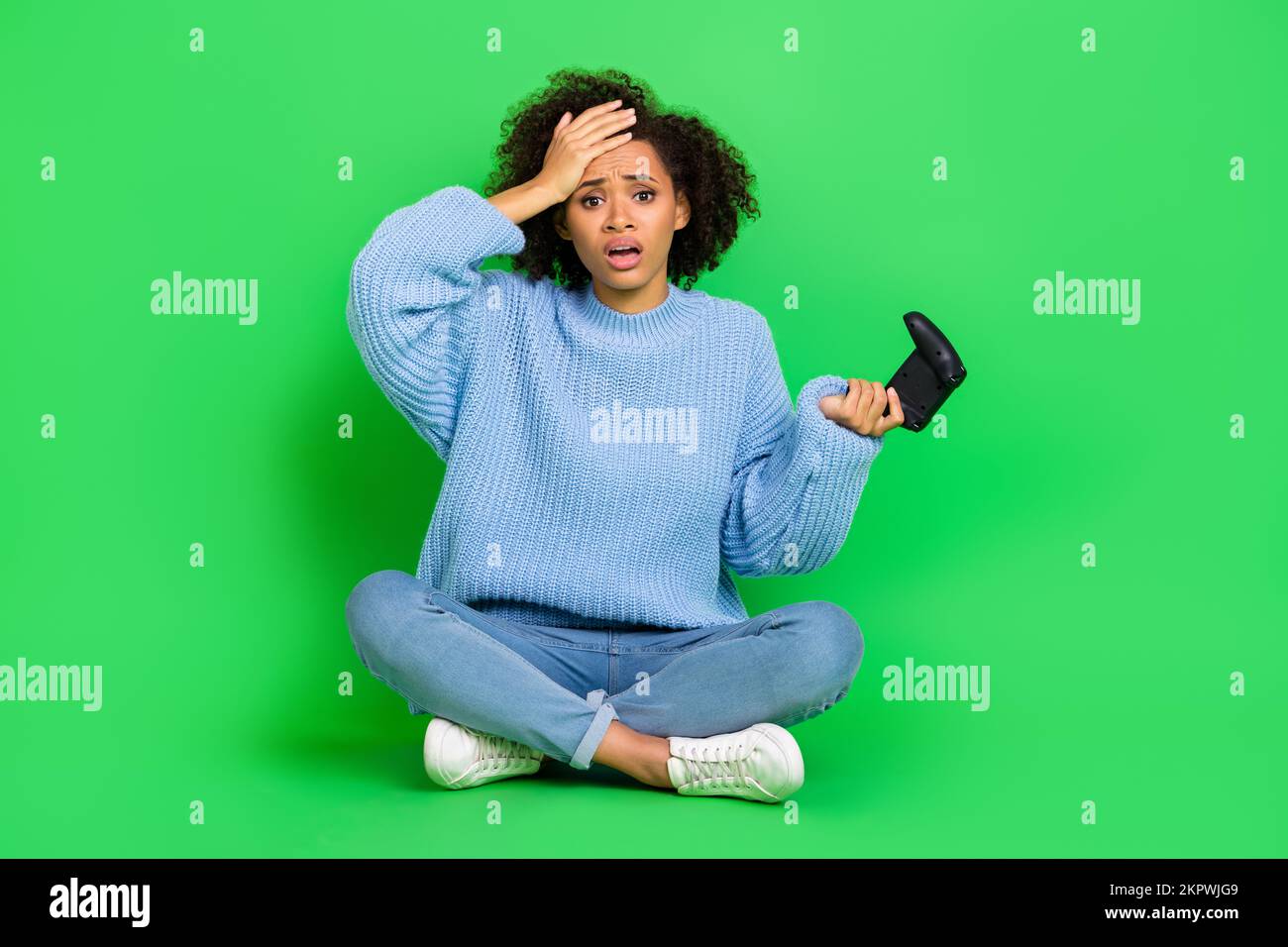 Full body photo of unsatisfied girl sit floor hand touch forehead hold ...