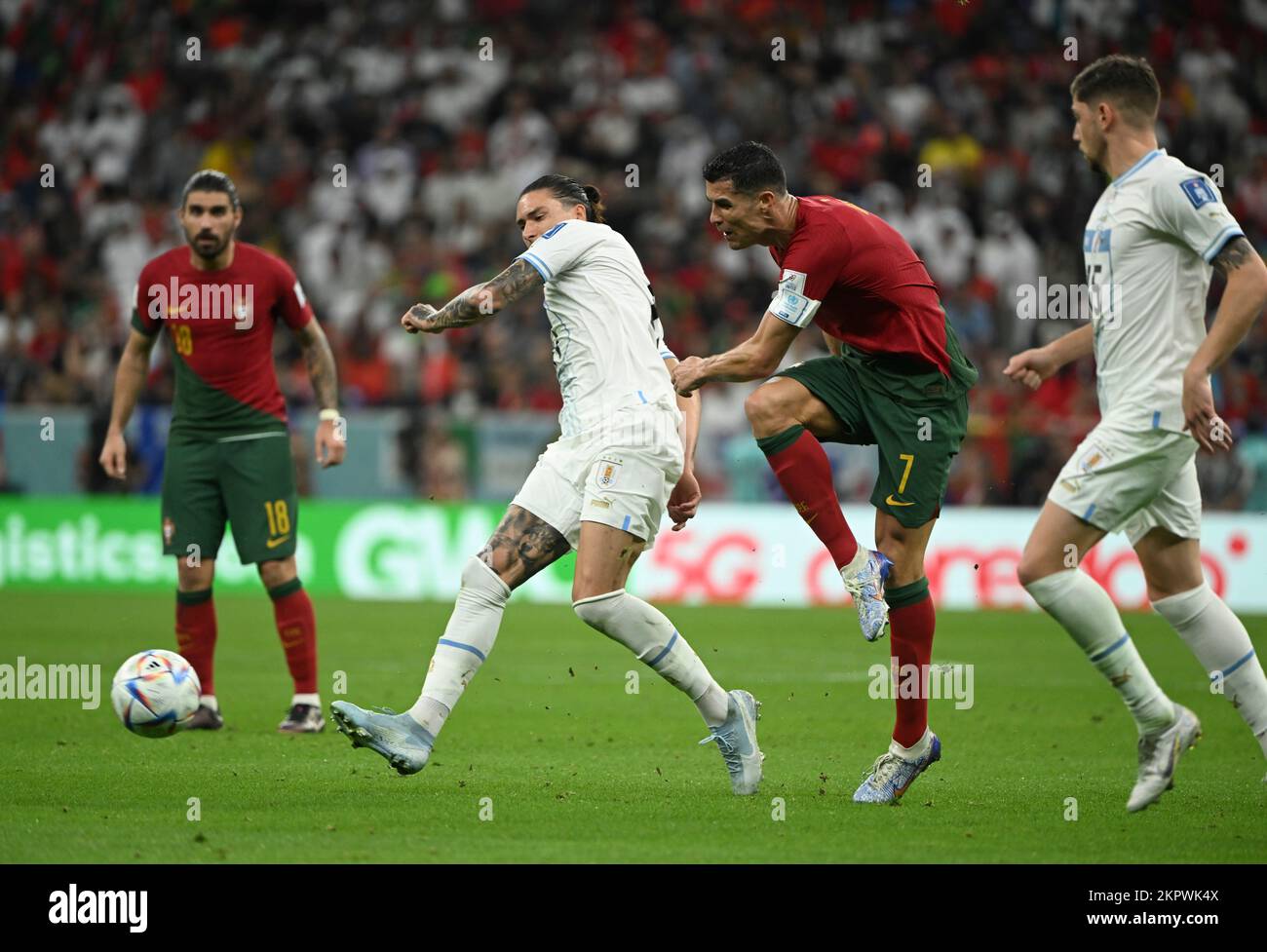 Lusail, Qatar. 28th Nov, 2022. Darwin Nunez (2nd L) of Uruguay vies with Cristiano Ronaldo of ...