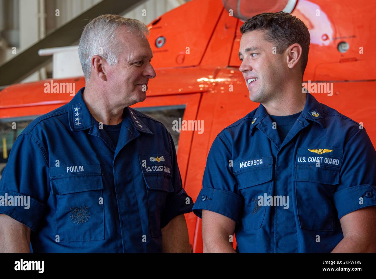 Coast Guard Adm. Steven Poulin, vice commandant of the Coast Guard, interacts with Petty Officer ...