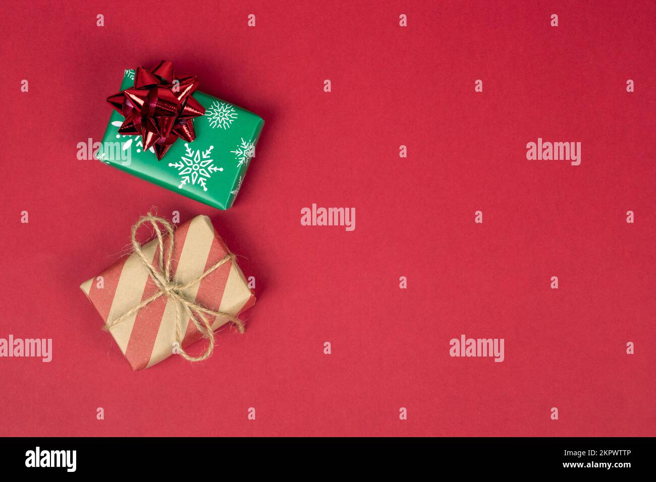 Two christmas and new year presents or gifts on red background with ...