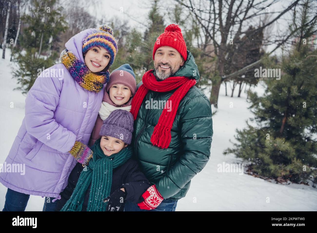 Portrait of four peaceful friendly people embrace cuddle sped pastime ...