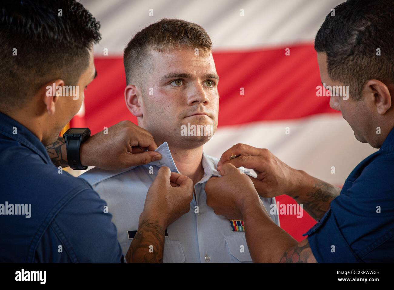 Coast Guard members replace the collar devices of Petty Officer 2nd ...