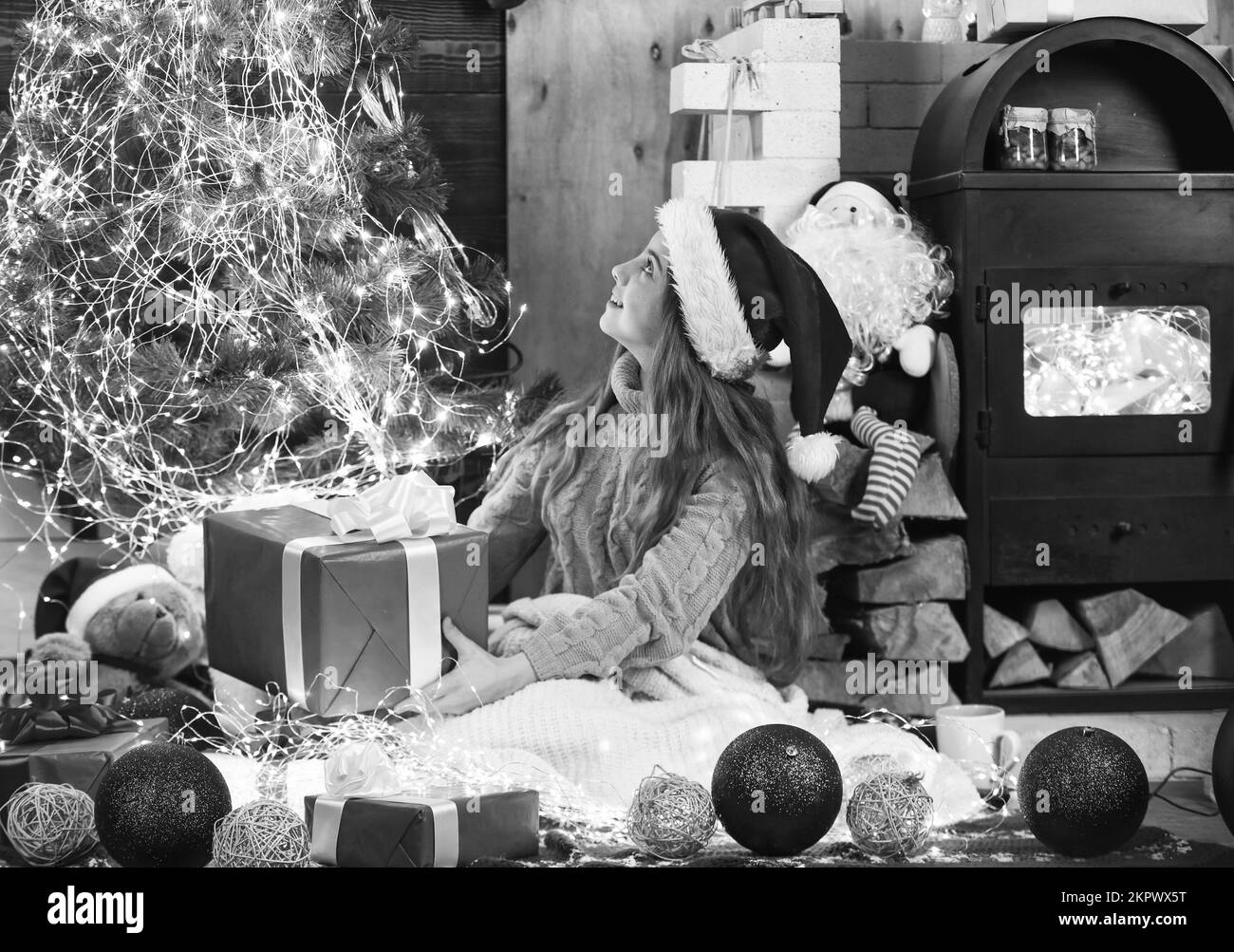 LED Lights concept. Little girl relax near christmas tree decorated ...