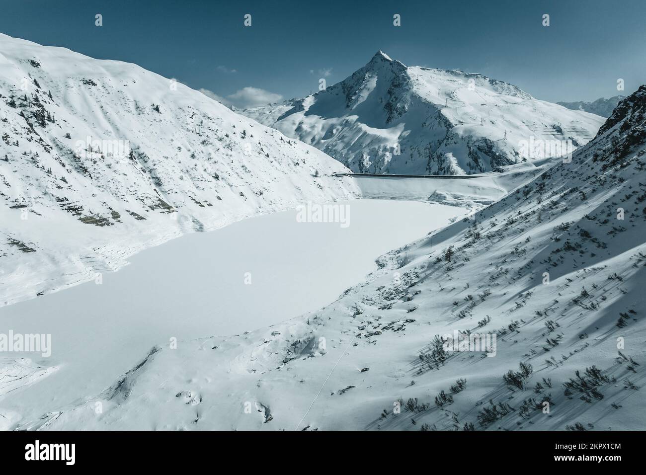 Aerial view of a frozen alpine lake above Gastein valley, Salzburg ...