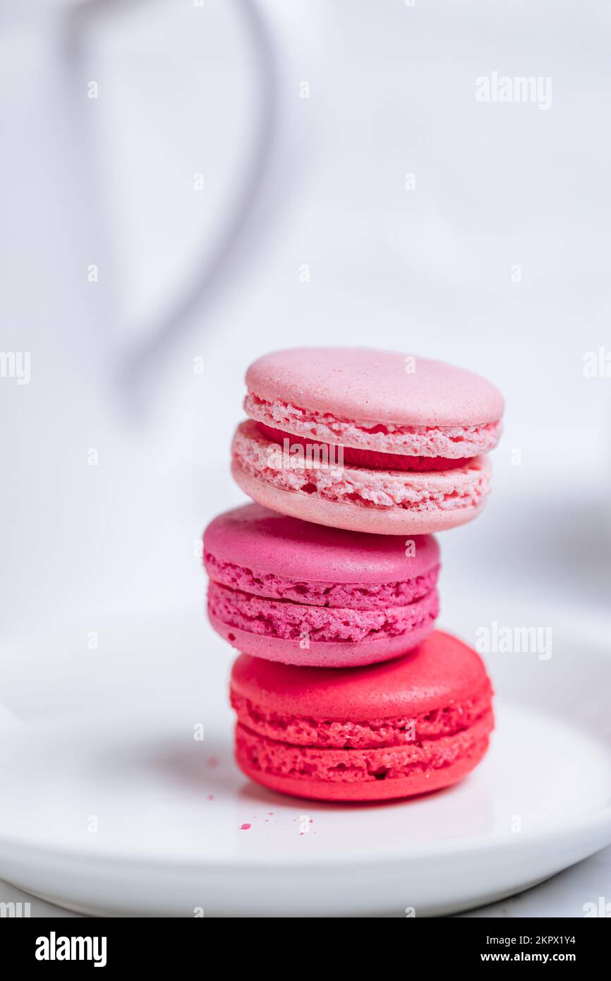 Close up of Macaroons in different colours on bright white background ...