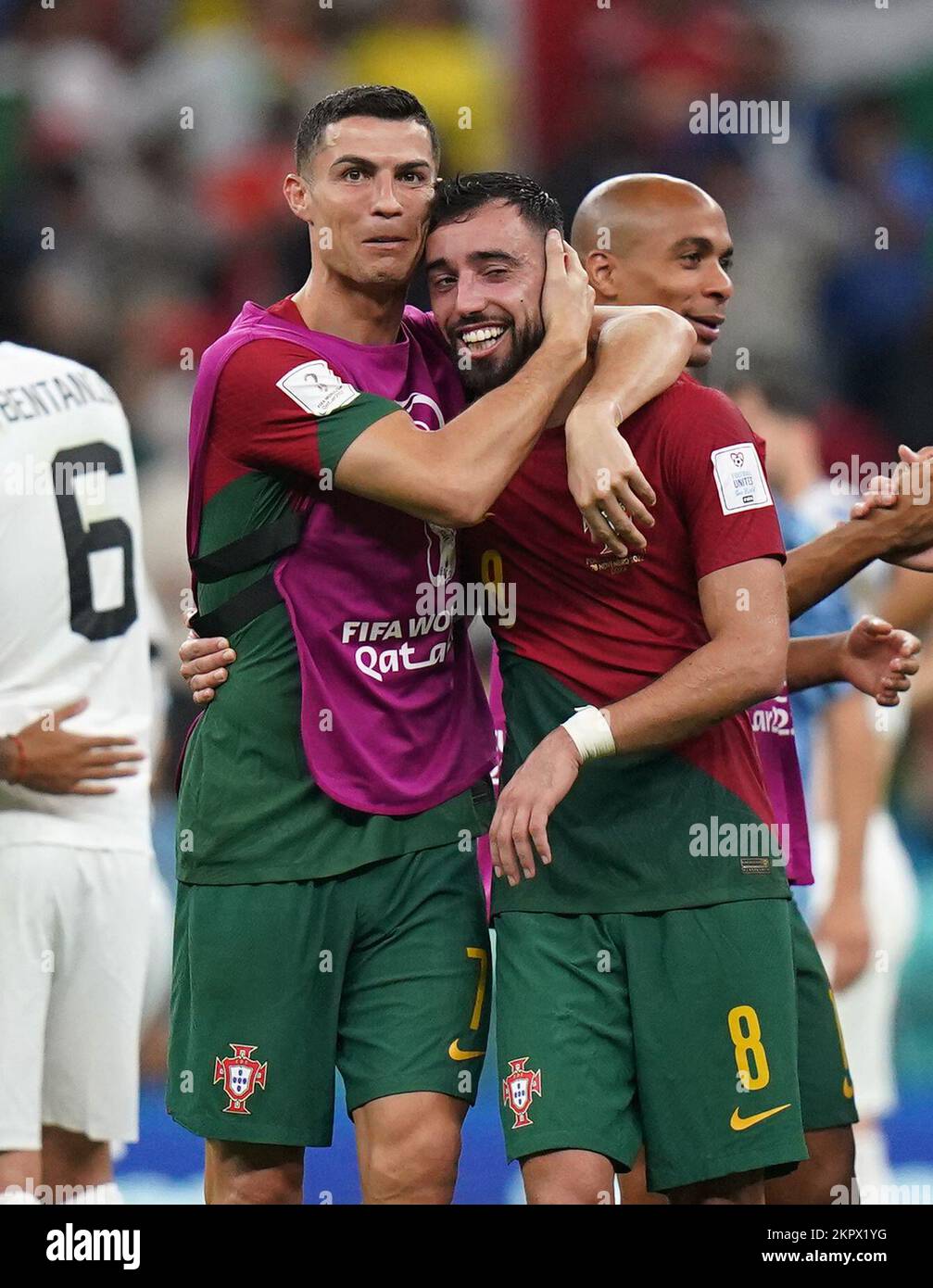 Portugal's Cristiano Ronaldo (left) and Bruno Fernandes embrace after ...