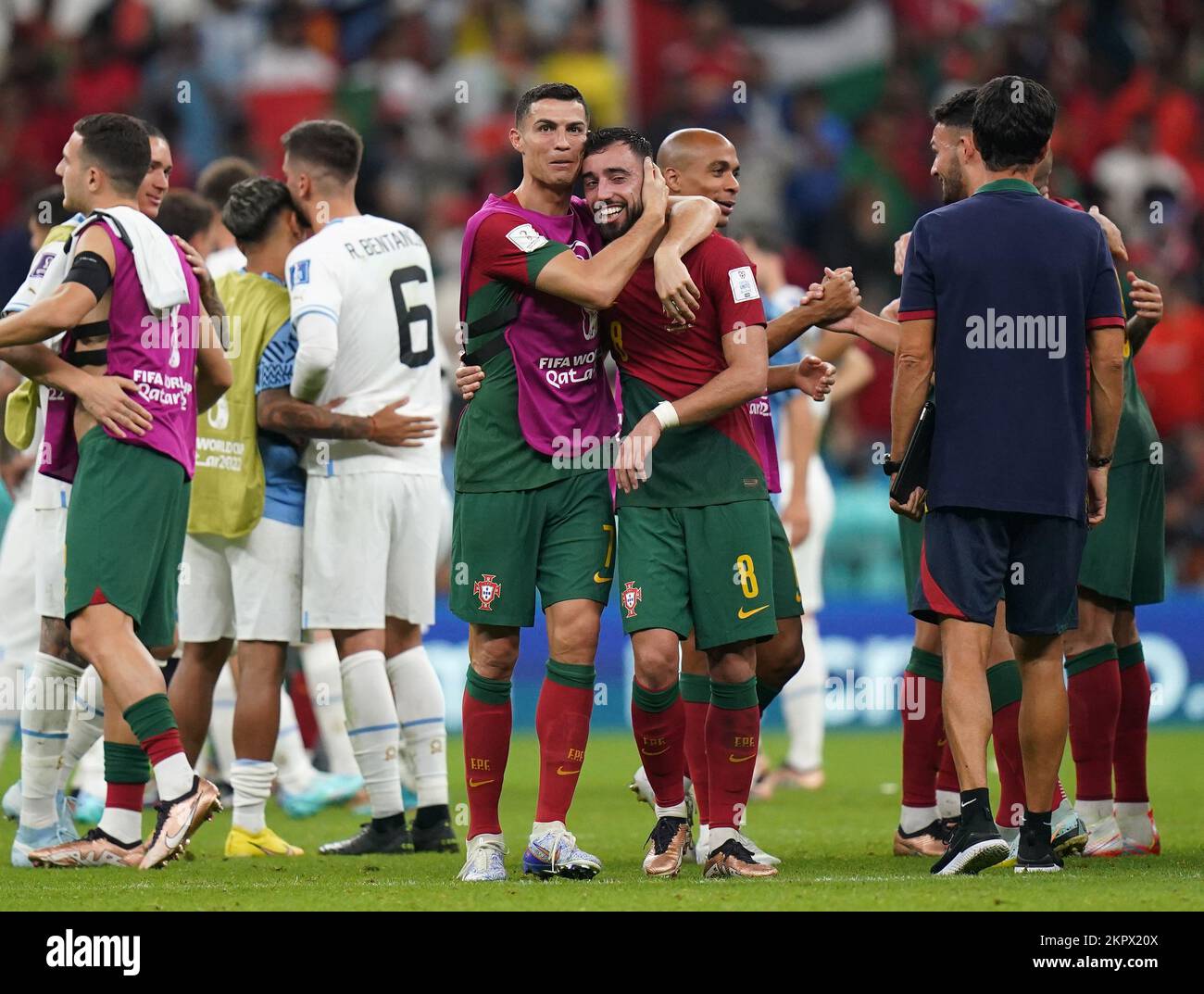 Portugal's Cristiano Ronaldo (left) and Bruno Fernandes embrace after ...
