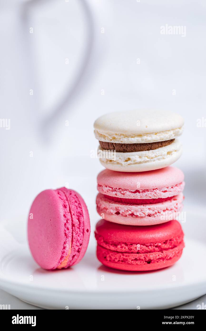 Close up of Macaroons in different colours on bright white background ...