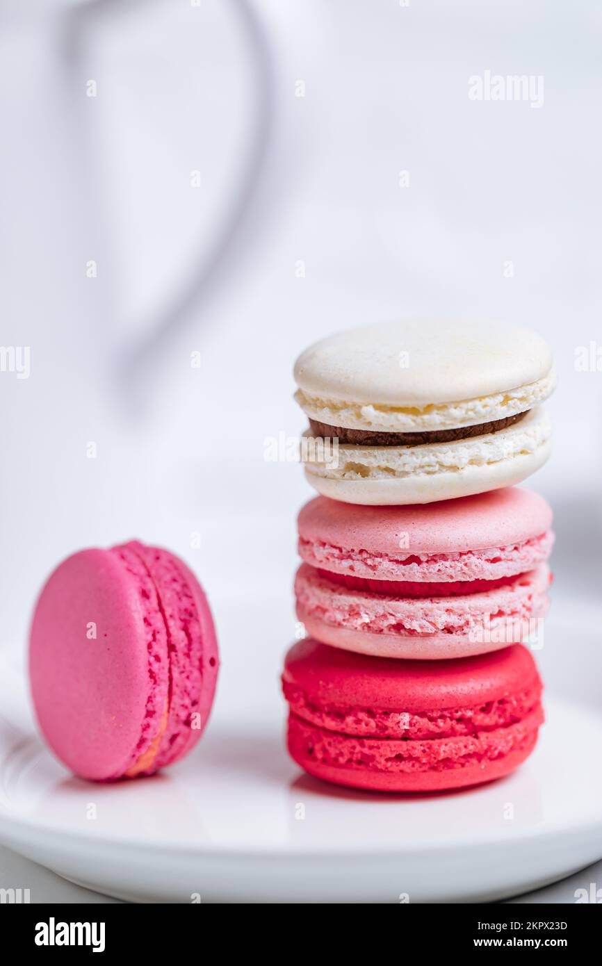 Close up of Macaroons in different colours on bright white background ...