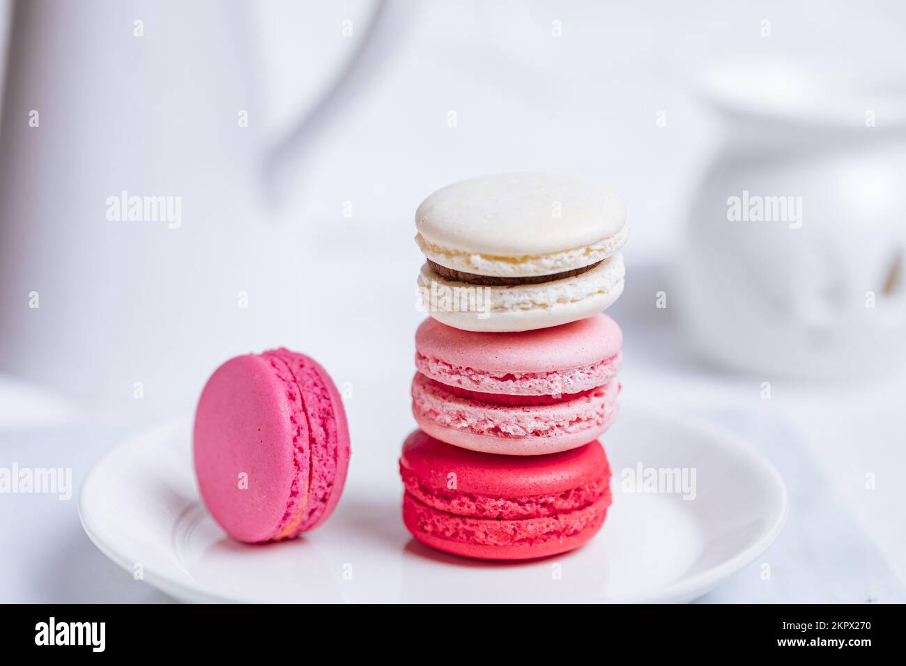 Close up of Macaroons in different colours on bright white background ...