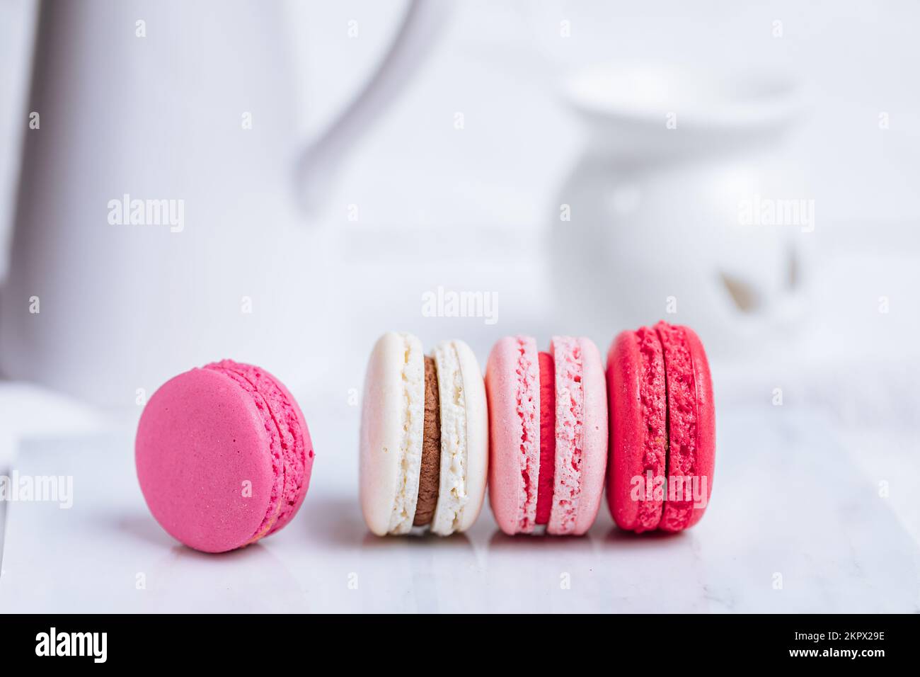 Close up of Macaroons in different colours on bright white background ...