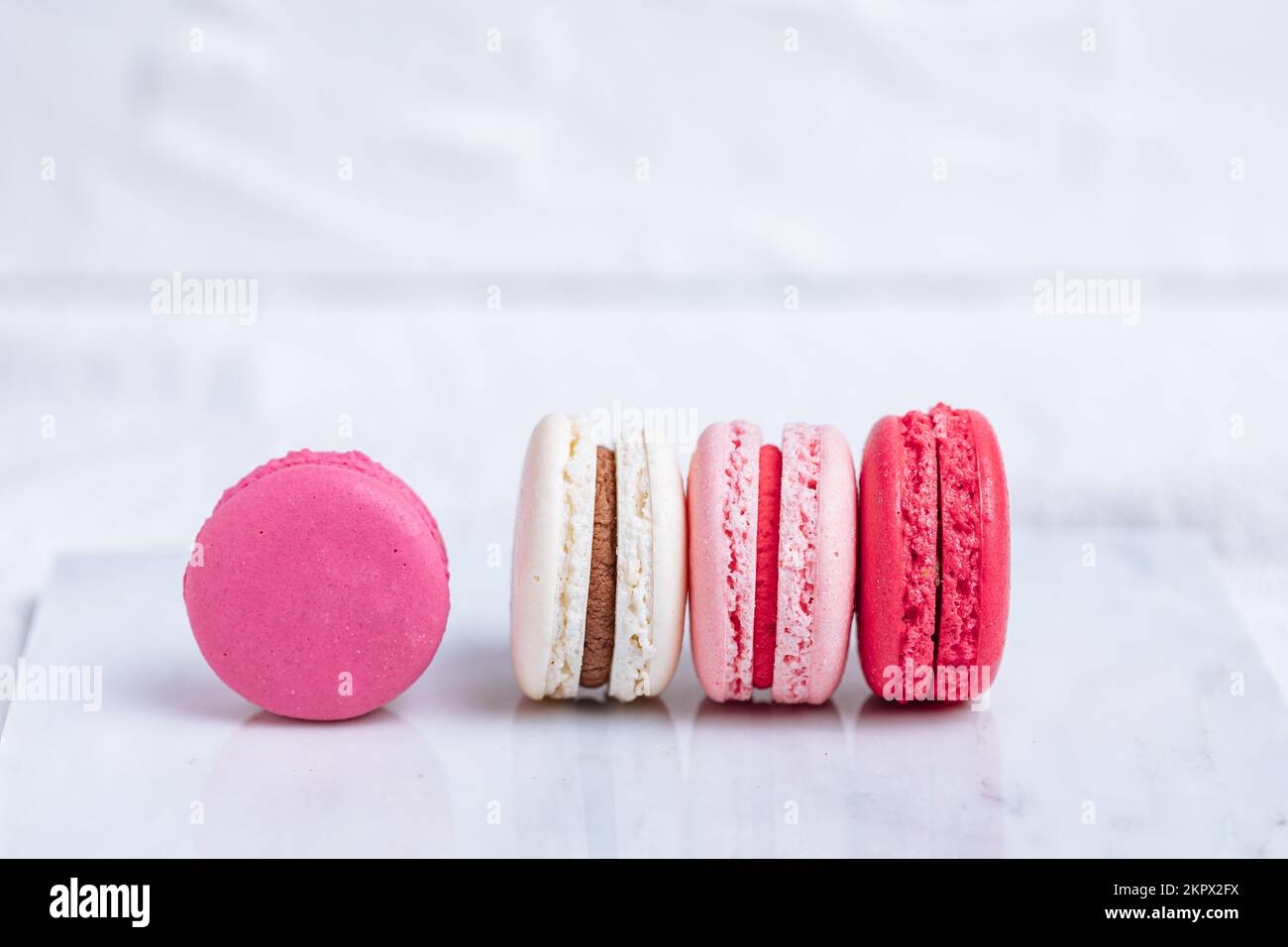 Close up of Macaroons in different colours on bright white background ...