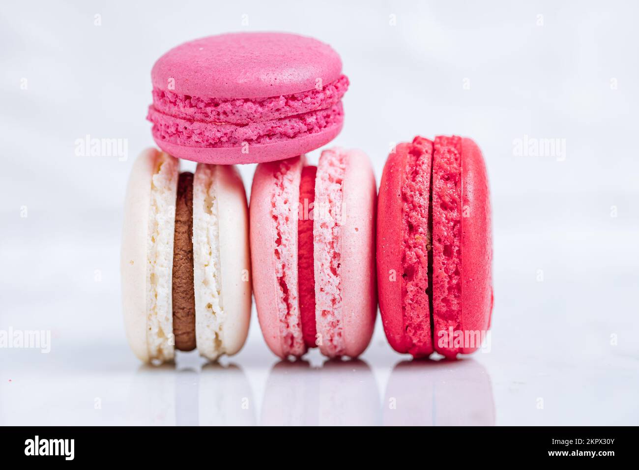 Close up of Macaroons in different colours on bright white background ...