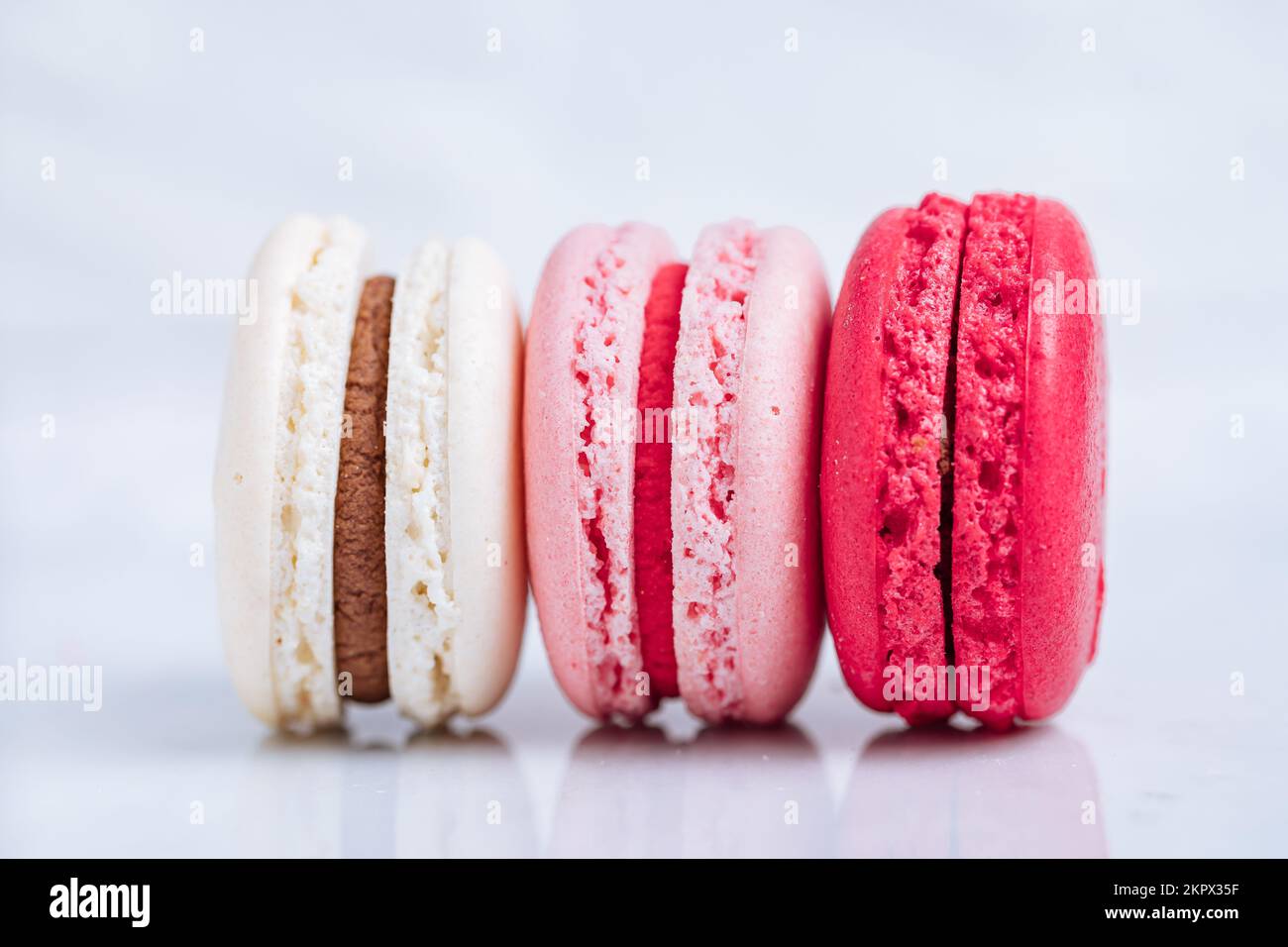 Close up of Macaroons in different colours on bright white background ...