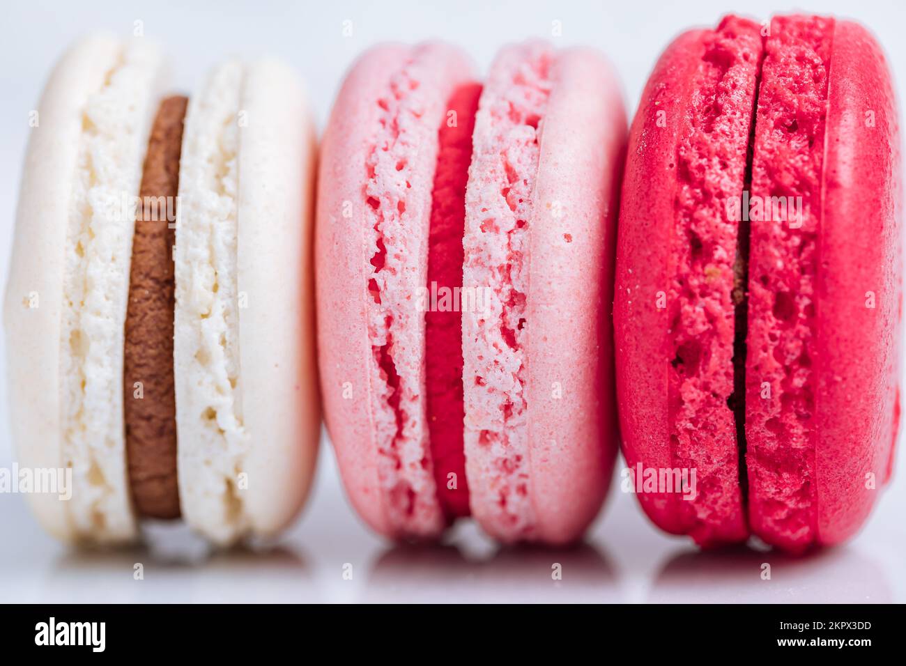 Close up of Macaroons in different colours on bright white background ...