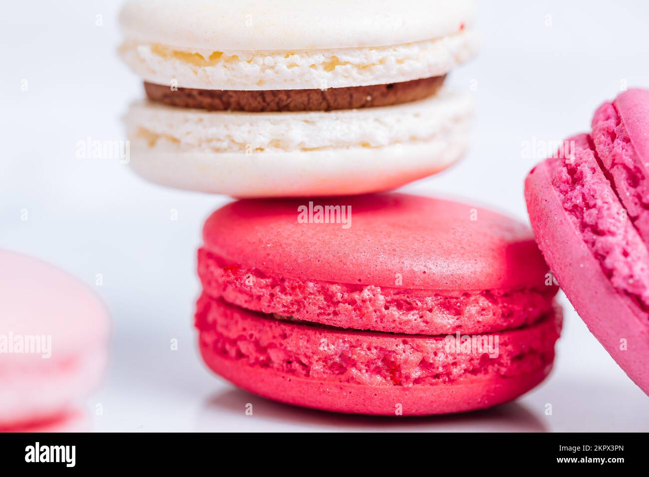 Close up of Macaroons in different colours on bright white background ...