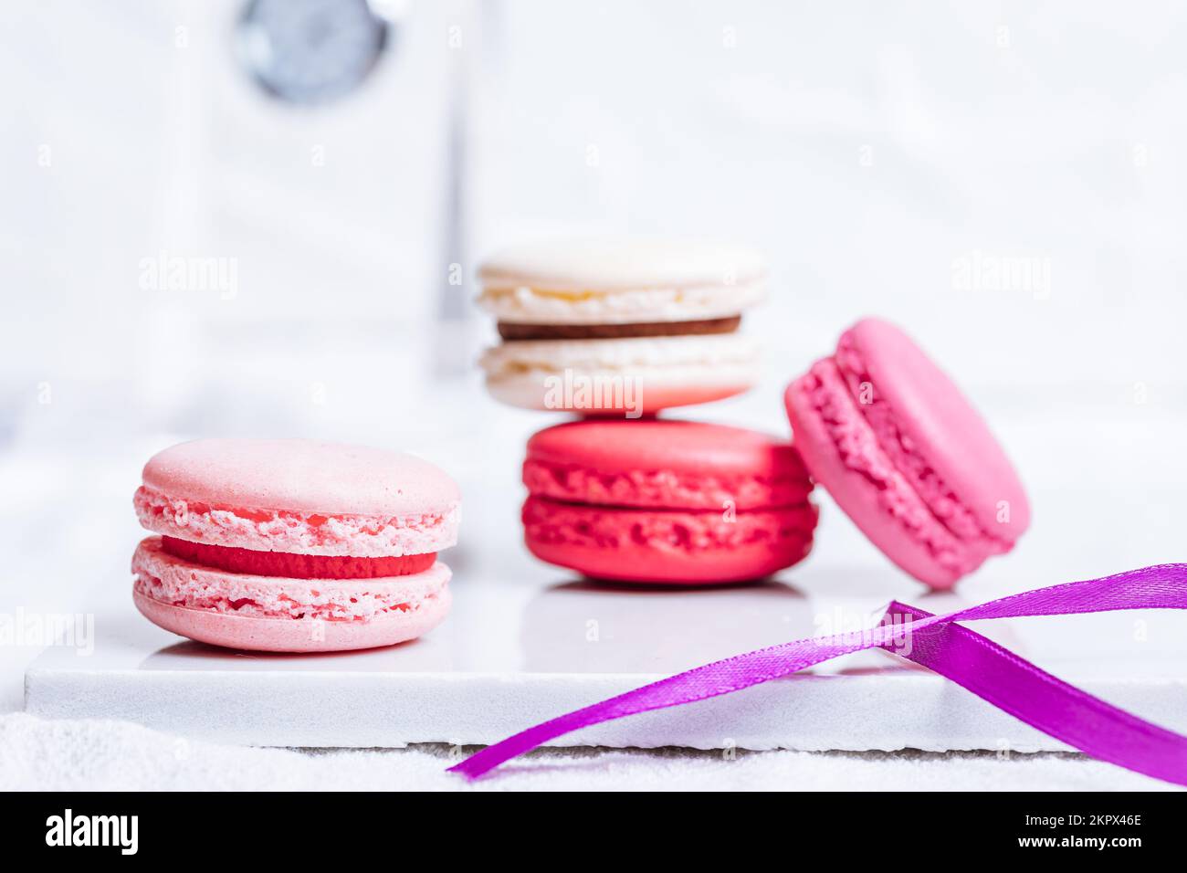 Close up of Macaroons in different colours on bright white background ...