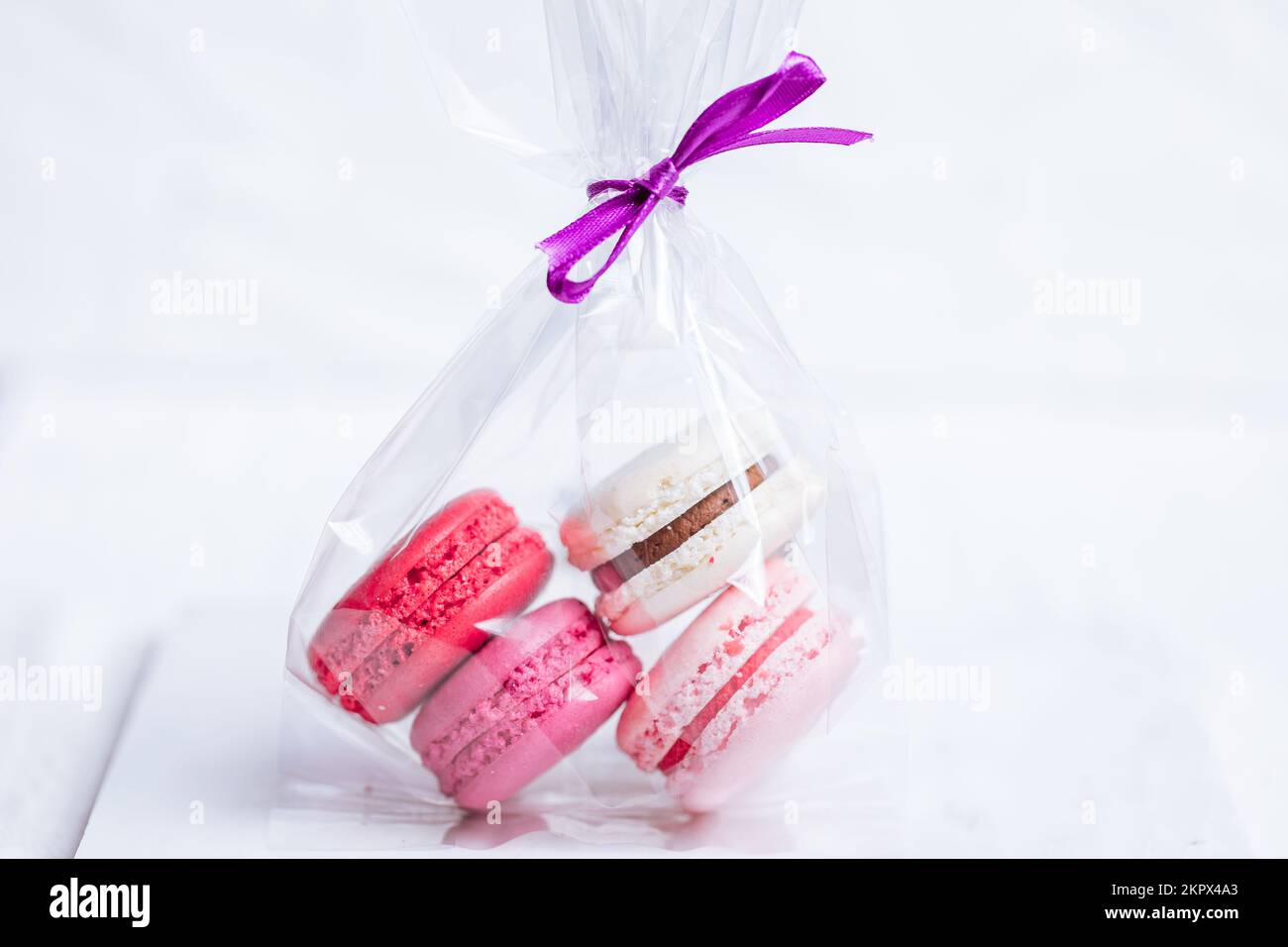 Close up of Macaroons in different colours on bright white background ...