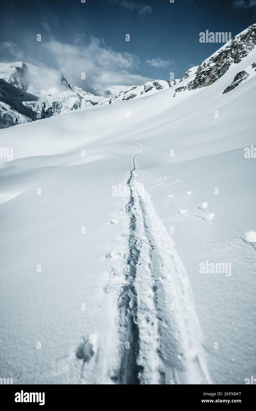 Ski tracks in deep snow in mountains, Austrian alps, Gastein, Salzburg ...