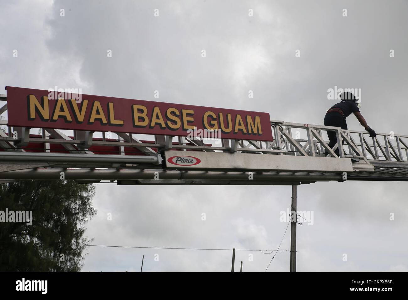 A firefighter ascends the ladder of an aerial fire truck during joint ...