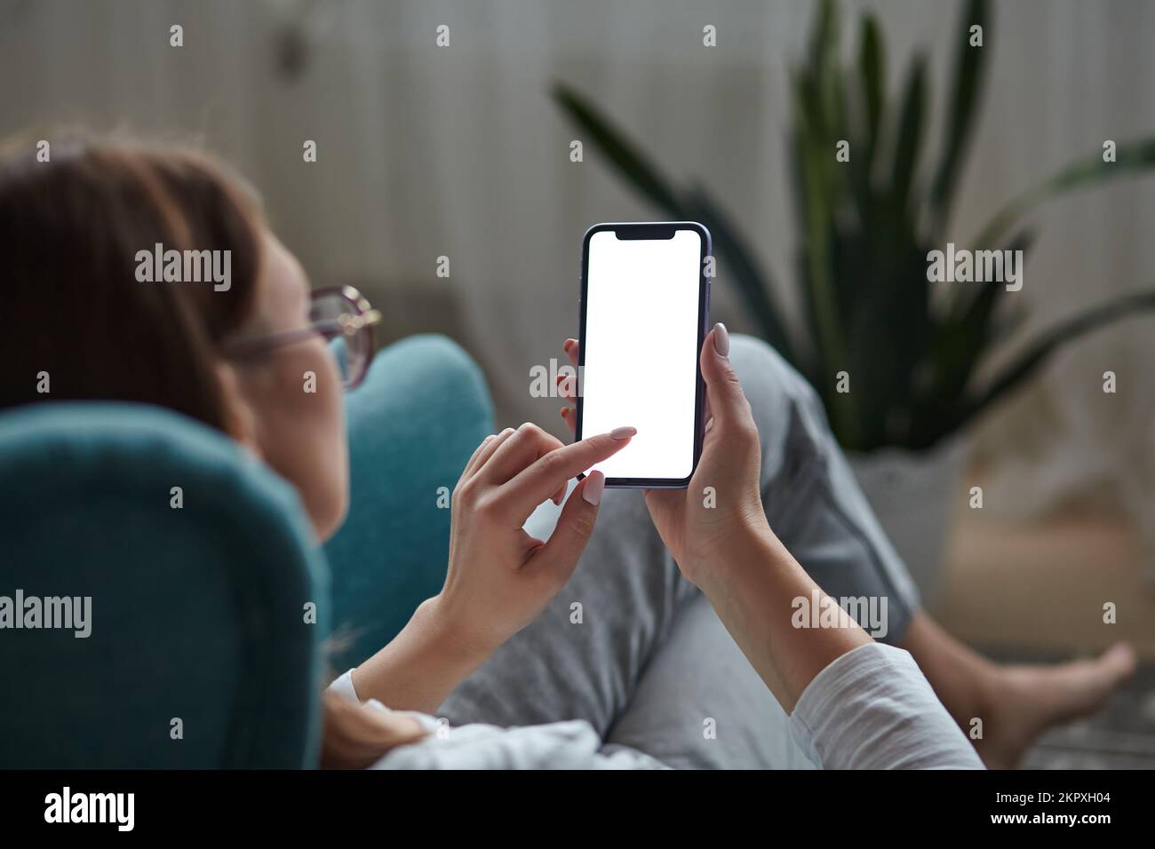 Woman hand holding using touch mobile phone white screen mockup Back ...