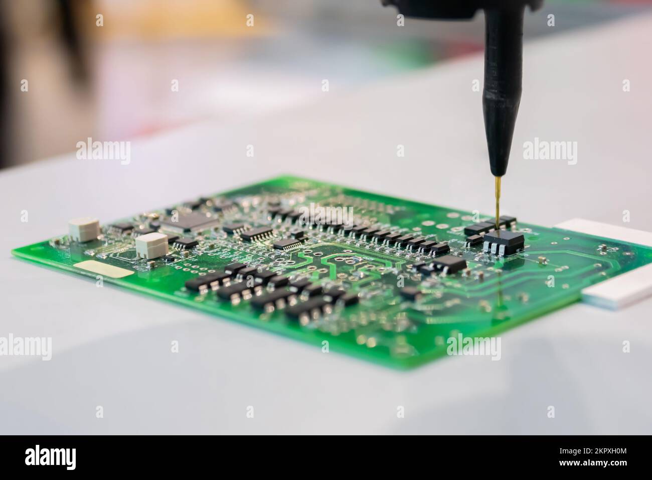Automatic manipulator with dispenser needle during work with SMT pcb ...