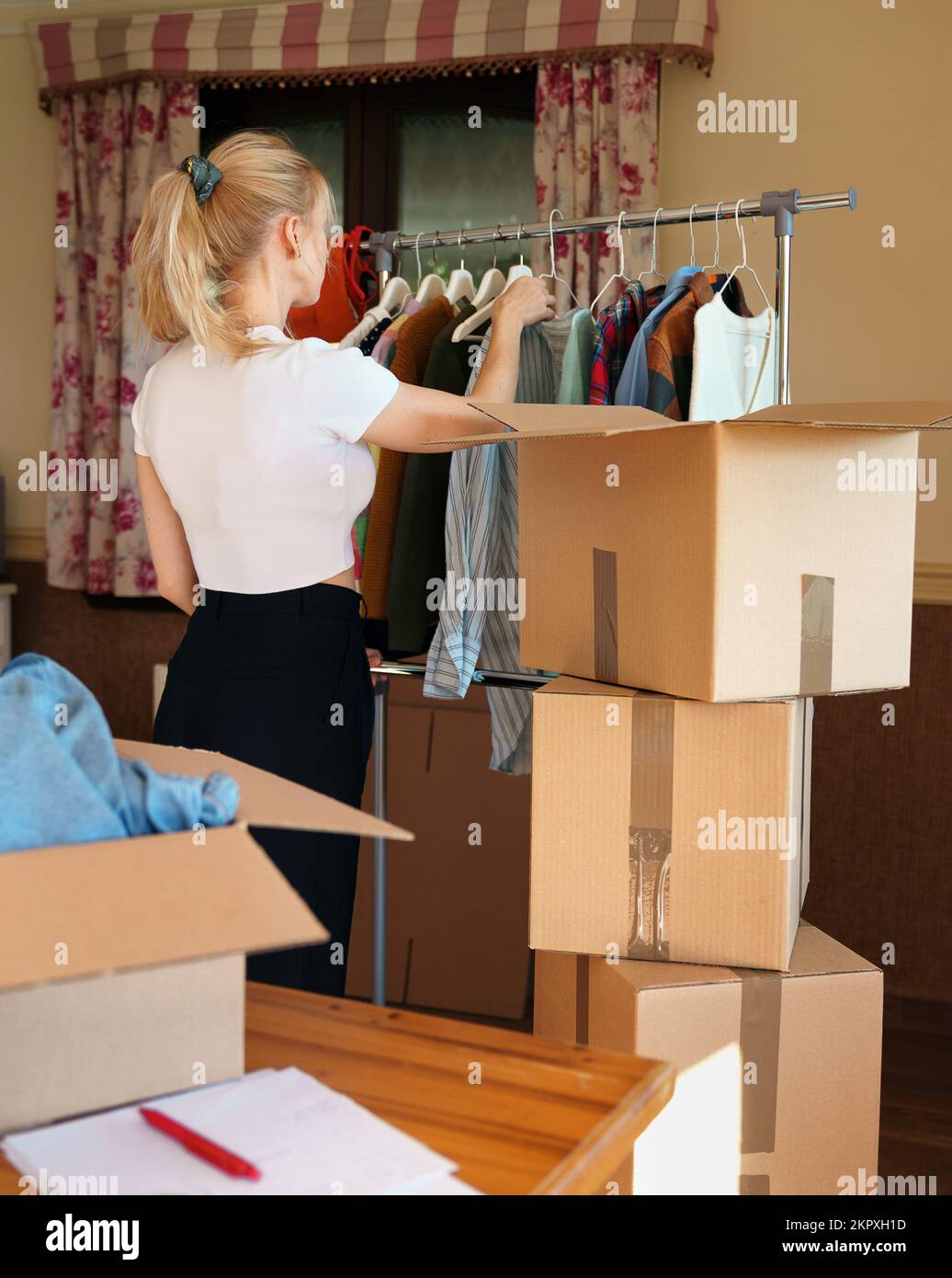 Pre owned clothes resale or donation Stock Photo - Alamy