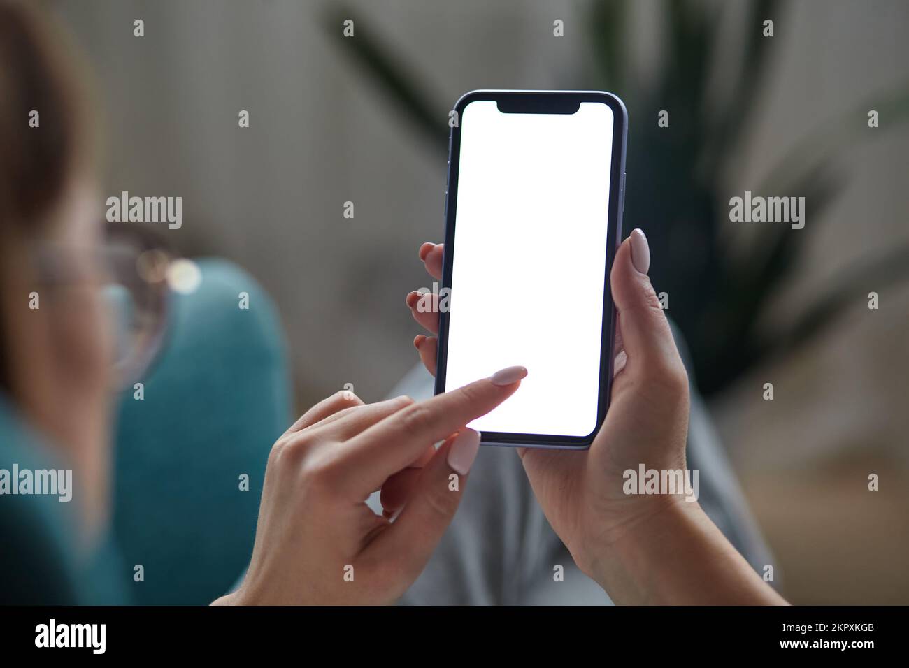Woman hand holding using touch mobile phone white screen mockup Back ...