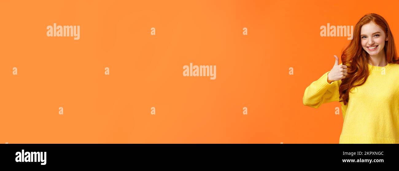 Confident and caring good-looking redhead sister rooting for sibling ...