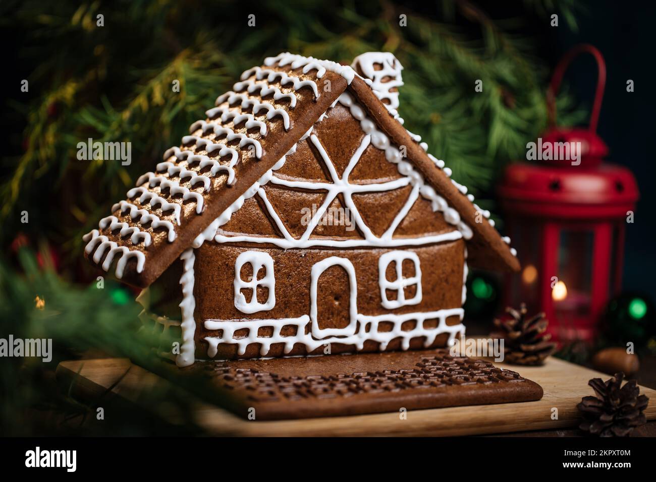 Gingerbread house with pine tree in background. Marry Christmas and ...