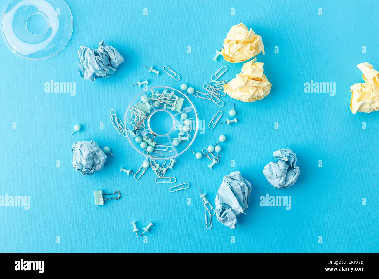 Concept of messy and chaos office desk office tools blue and yellow ...