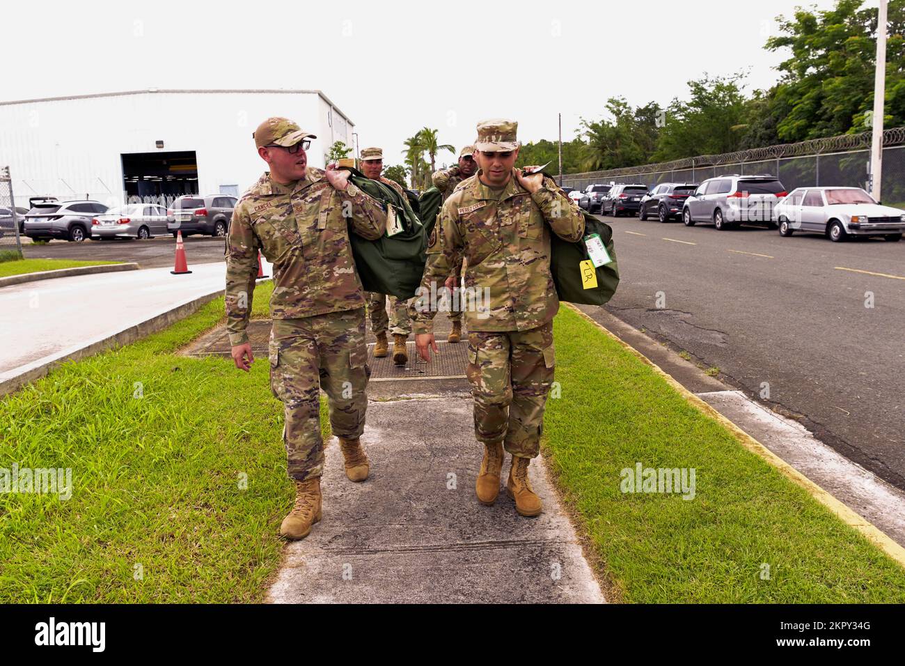 U.S. Airmen with the 156th Wing, Puerto Rico Air National Guard, walk ...